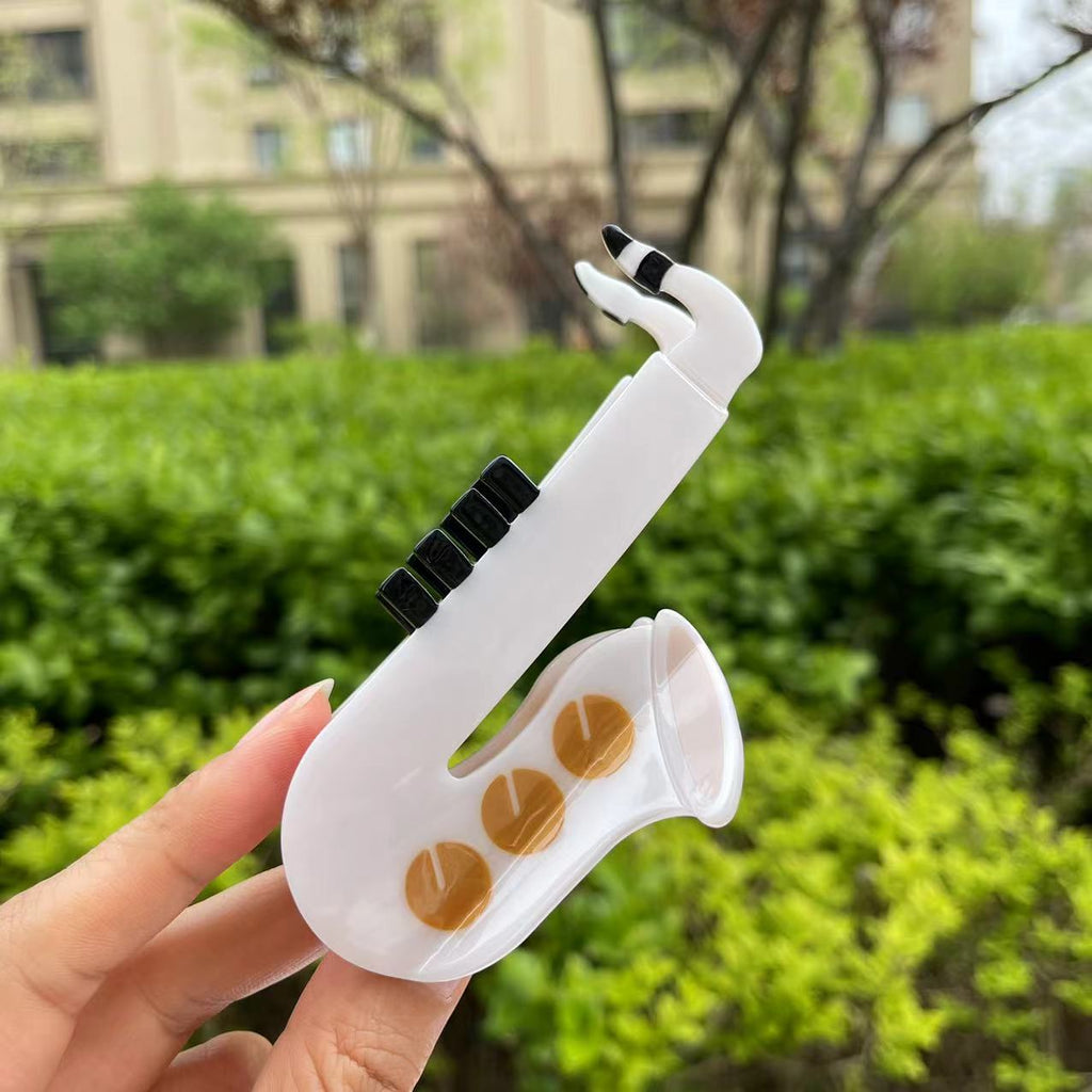 White saxophone hair claw