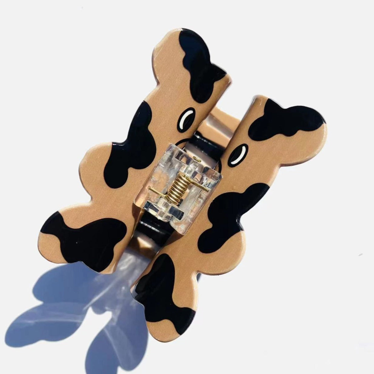 CURIOUS COW claw within Brown